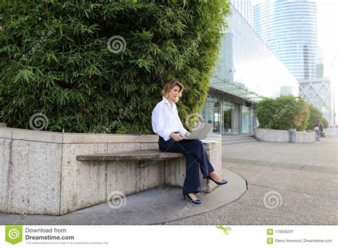 Statistician Working Outside With Laptop And Color Diagrams Stock