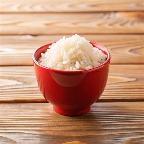 A Red Bowl Of Rice With A Red Bowl Of Rice Premium Ai Generated Image