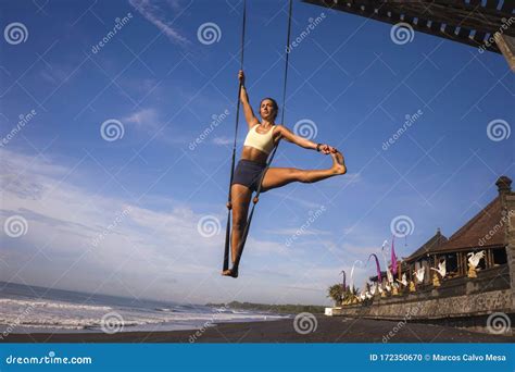 Aerial Yoga Beach Workout Young Attractive And Healthy Woman