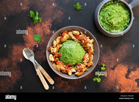 Mashed Potatoes With Green Peas And Corn Served With Chicken And