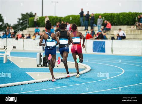 Three Female Endurance Runners Race On A Blue Track Track And Field Illustration Photo Sports
