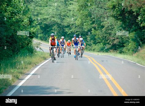 Bicycle Riders In Full Safety Gear Riding The Real Public Highways Of