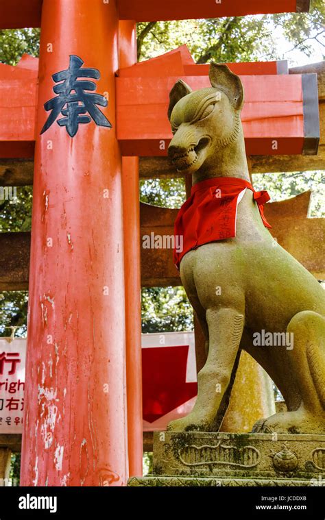 Fushimi Inari Taisha Shrine Torii Gates And Fox Statue Stock Photo