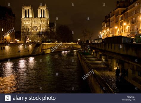 Cathedral Notre Dame de Paris at night on ële de la Cit by the river