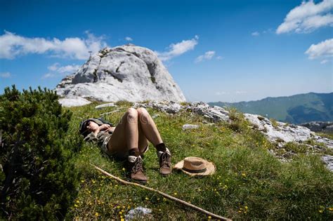 Young Caucasian Woman Lying Down And Taking A Rest In The Grass On A