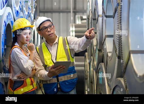 Senior Engineer Manager Trains New Employees Within The Metal Sheet