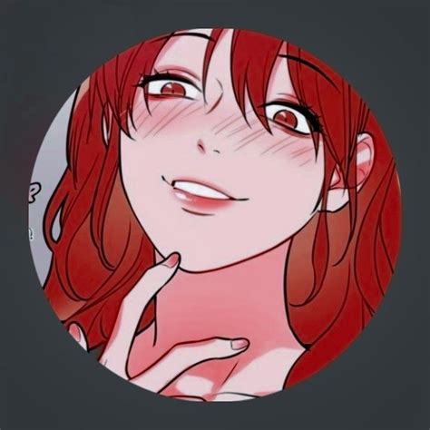 A Woman With Red Hair Is Looking At The Camera And Has Her Hand On Her Face