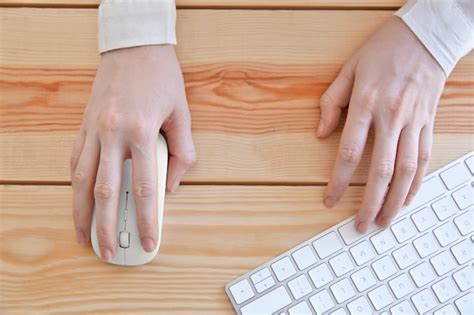 Premium Photo Female Hands With Computer Mouse And Keyboard On Wooden