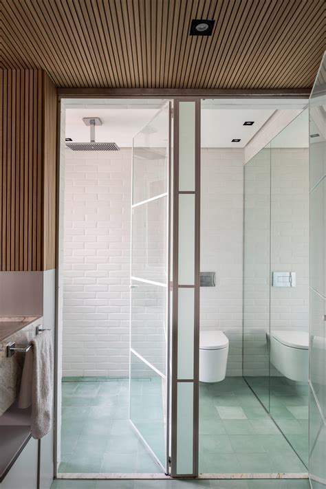 Pivoting Wood Doors Soften São Paulo Apartment By Nildo José Architects