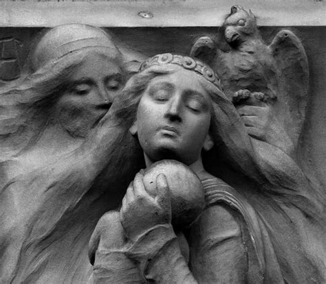Premium Photo A Statue Of A Woman With A Ball On Her Head Is