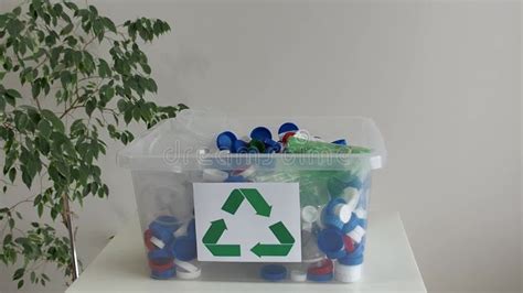 Man Sorting Plastic Drink Bottle Caps And Lids Recyclable Materials For Recycling Stock Video