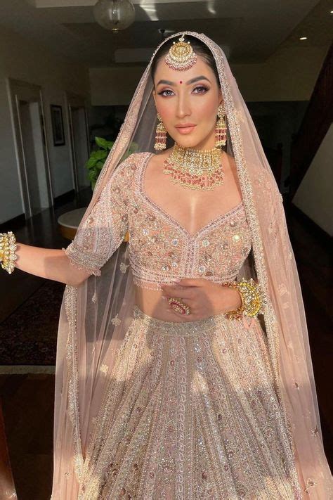 Bride In A Pastel Lehenga Coupled With Jjadau Jewellery A Pink Bridal