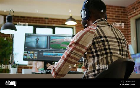 African American Filmmaker Editing A Video Shoot In Post Production Using A Modern Tech Setup