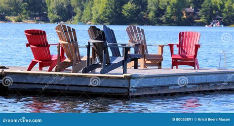 Six Adirondack Chairs On The Dock Stock Image Image Of Chairs