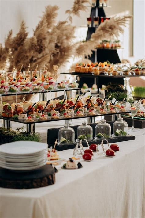 Assortment Of Delicious Snacks On The Open Buffet Festive Table In