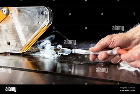 Circular Saw Guard Safety Test Researcher Using Smoke To Test The Air