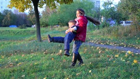 Younger Brother Kisses His Sister Covered With A Blanket Stock Video