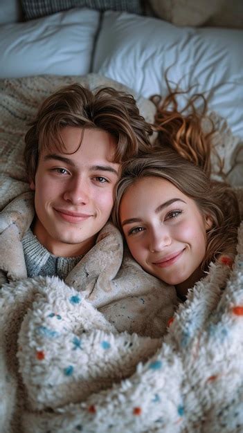 Premium Photo Above A Young Couple In Their Bedroom Curled Together