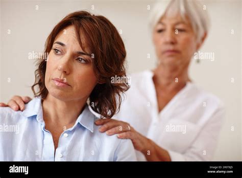 In Need Of Some Tlc A Senior Woman Comforting Her Daughter Whos Going