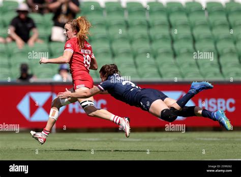 Carissa Norsten Of Canada Runs In For A Try Under Pressure From Alyssa