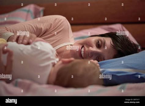 Mother Is Playing With Baby At Home Stock Photo Alamy