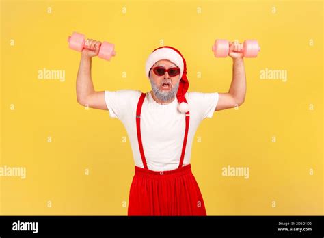 Assertive Funny Man In Santa Claus Costume Rising Hands Holding