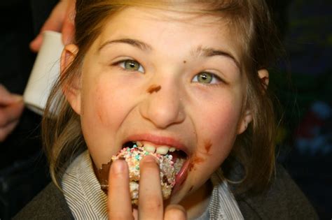 Premium Photo Portrait Of Girl Eating Sweet Food