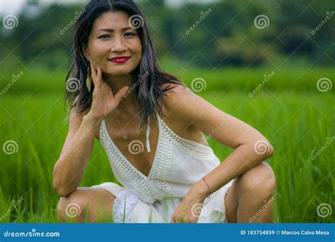 Outdoors Holidays Portrait Of Attractive And Happy Middle Aged Asian