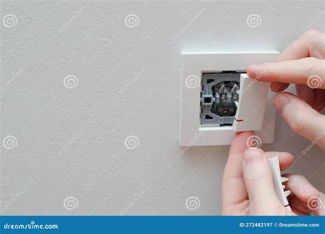 An Electrician Is Replacing A Wall Switch A DIY Project Concept High Voltage Danger Male