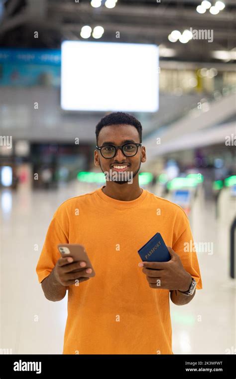 Young Handsome Black Man Ready To Travel At Airport Terminal Waiting