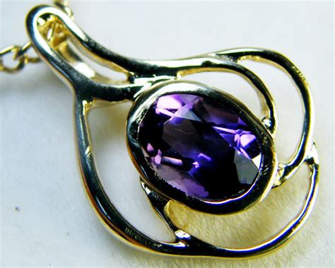 Cute Amethyst Set In 14 K Gold Pendant
