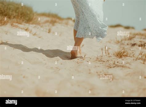 Back View Of Crop Unrecognizable Barefoot Female In White Summer Dress