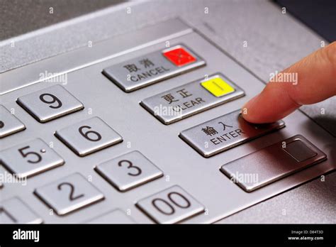 Hand Entering Personal Identification Number On Atm Dial Panel Stock