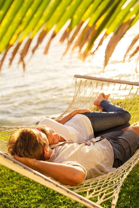 Couple Relaxing In Tropical Hammock Stock Image Image Of Leisure
