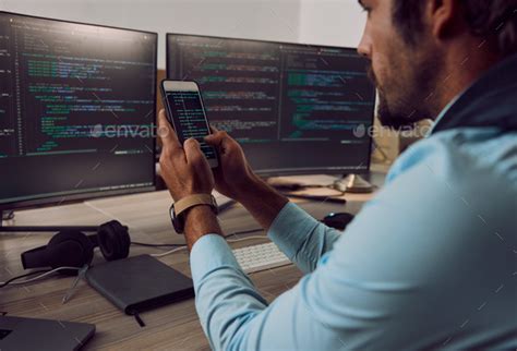 coding computer screen and phone with man programmer and software