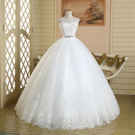 White Lace Appliqués Tulle Wedding Gown Featuring Beaded Lace Adorned Sweetheart Bodice Beaded