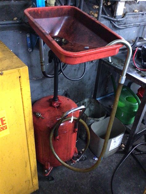 Lot 62 Portable Oil Draining System With Red Bottle