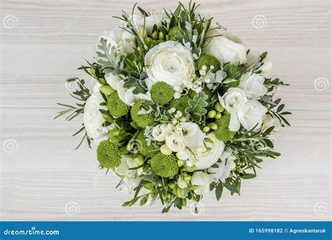 Wedding Bouquet With White Flowers And Green Leaves Stock Photo Image Of Lilly Petal