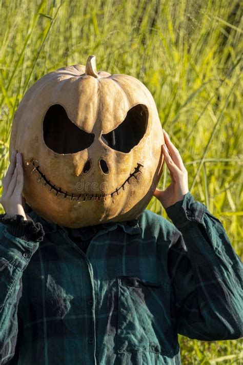 Young Woman With Pumpkin Head After Cutting It Off And Putting A Face