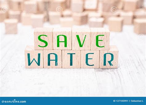 The Words Save Water Formed By Wooden Blocks On A White Table Stock