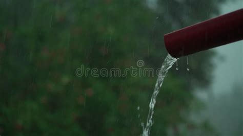 Rain Drainage System Metal Gutter With Pouring Water At Rainy Storm