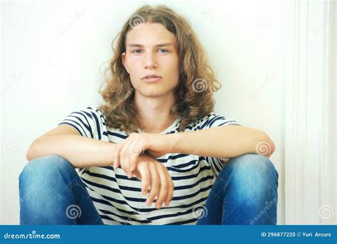 Man Face And Hair With Beauty Trendy Hipster With Curly Hairstyle And