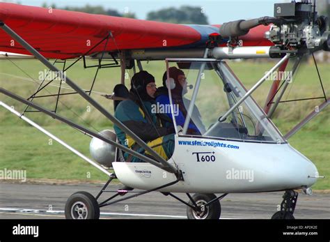 A Fixed Wing Microlight Aircraft Prepares To Take Off From A Small