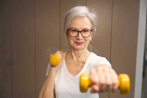 Active Pensioner Goes In For Sports With Dumbbells Stock Photo Image Of Lady Space