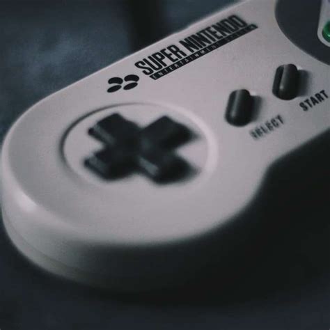 Selective Focus Photography Of Snes Controller Sliding Puzzle On