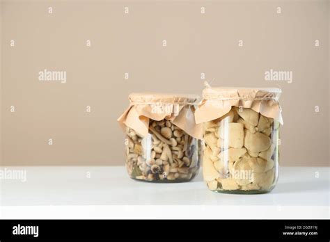 Pickled Mushrooms In A Glass Jars Mushrooms With Herbs And Spices