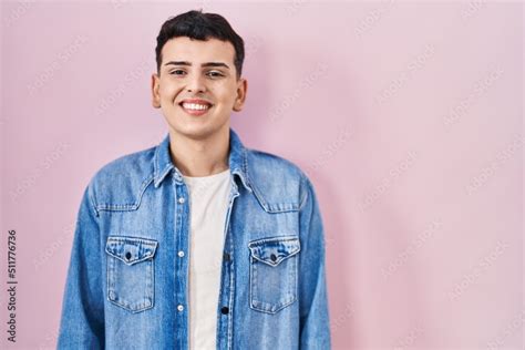Non Binary Person Standing Over Pink Background Looking Positive And Happy Standing And Smiling