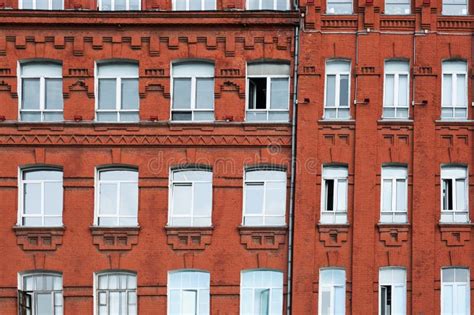 Windows With White Frame On Red Brick Wall Exterior Front Street View