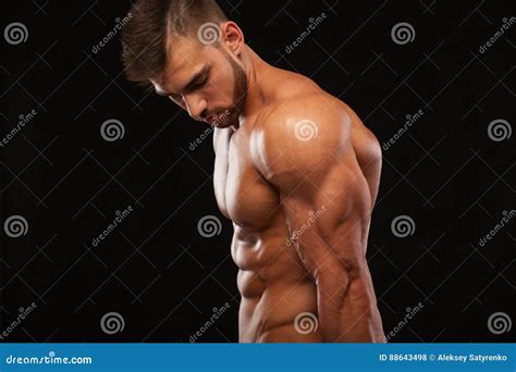 Strong Athletic Man Fitness Model Showing His Perfect Back Isolated