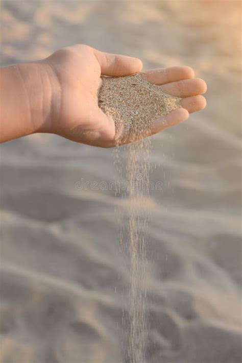 Girl Pouring Sand From Hand Outdoors Closeup Fleeting Time Concept